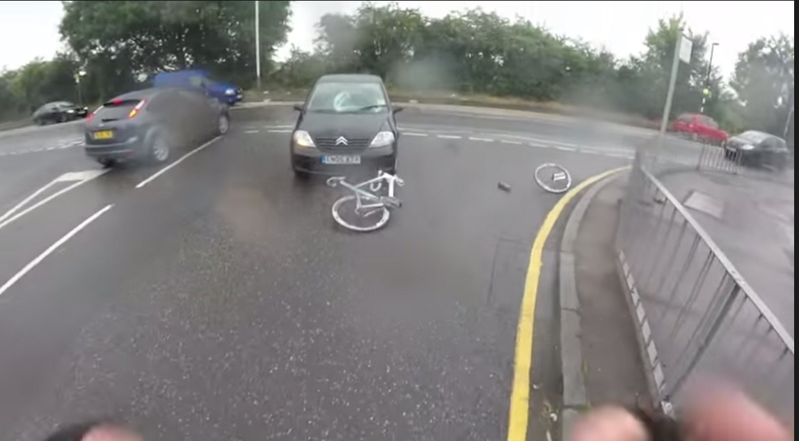 Guy on a bike hit by a car and catches it all on a h...